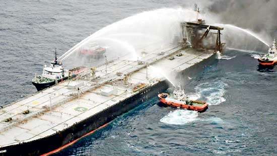 Air Force drops 4,000 kg of chemicals on blazing oil tanker - Front ...