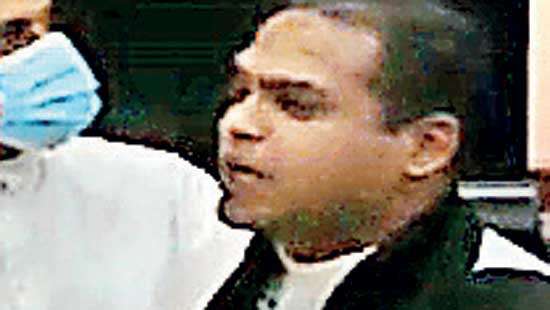 Jailing of former MP Ranjan Ramanayake Harin wears a black ‘Satakaya ...