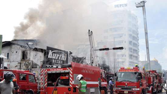Dousing the fire at Wellawatte - Caption Story | Daily Mirror