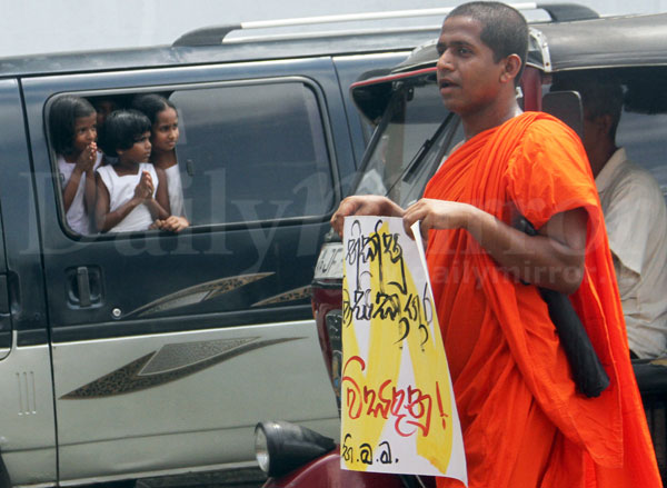 Monks protest against oppression - Caption Story | Daily Mirror